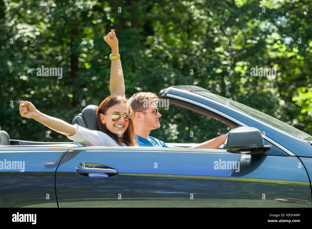 Couple Enjoying Drive In A Car Stock Photo - Alamy