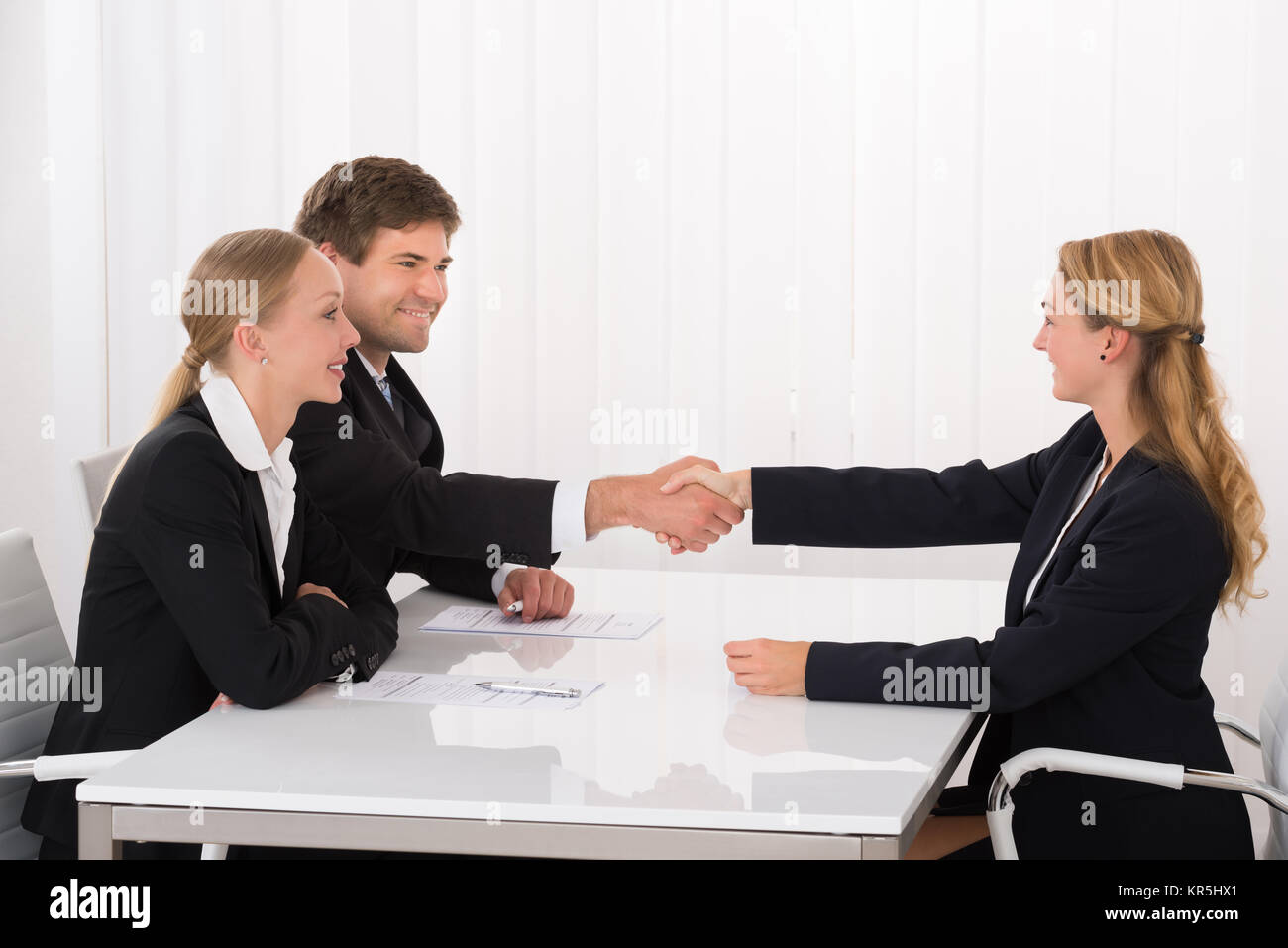 Male Candidate Shaking Hands During Interview Stock Photo - Alamy