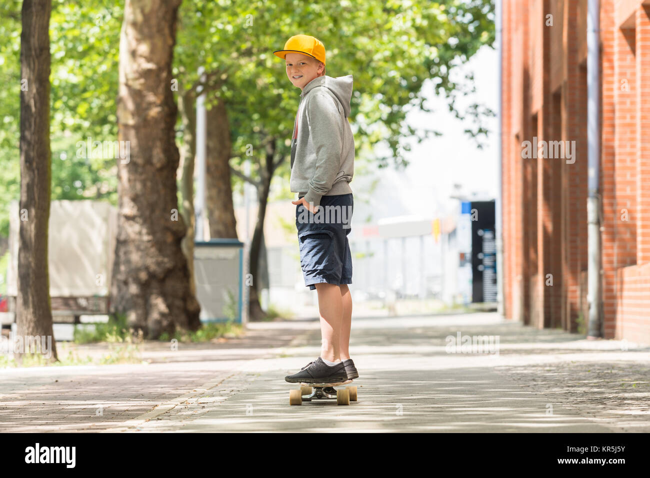 Boy Riding Skateboard Stock Photo - Alamy