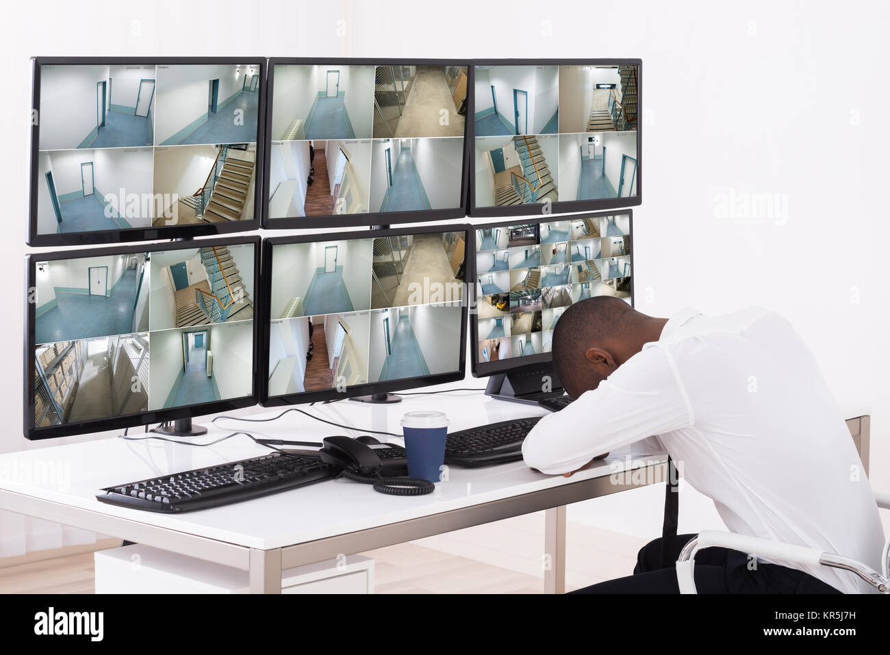 Young Male Operator Sleeping On Desk Stock Photo - Alamy