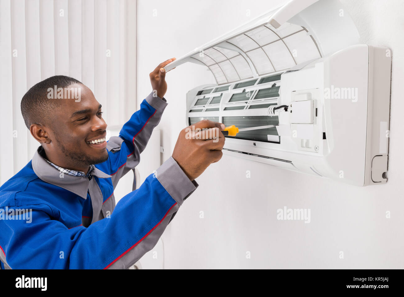 Technician Repairing Air Conditioner Stock Photo - Alamy