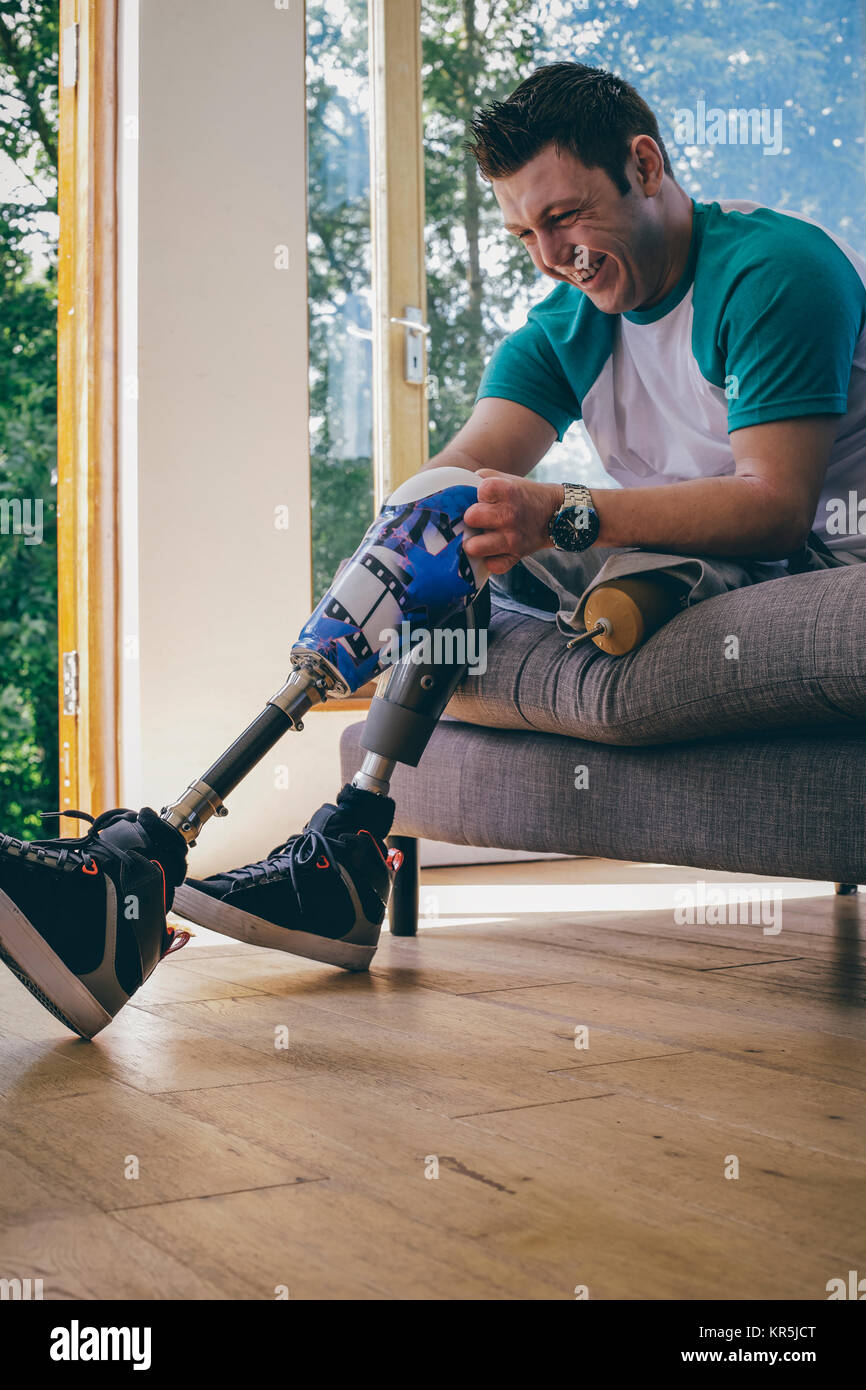 Amputee Attaching his Legs Stock Photo - Alamy