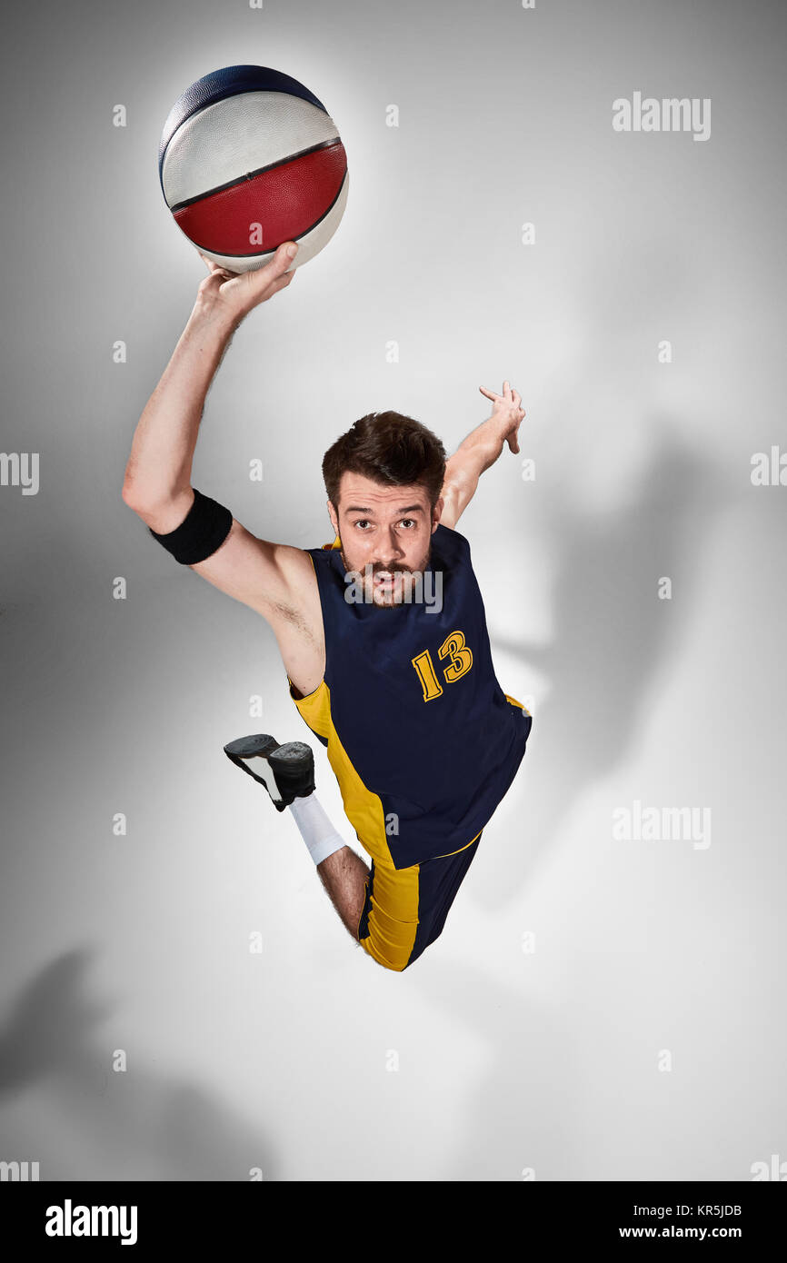 Full length portrait of a basketball player with ball Stock Photo - Alamy