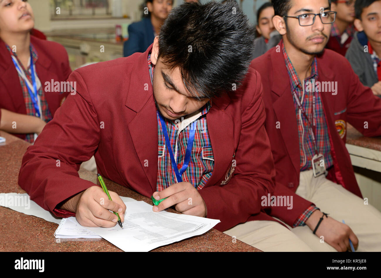 Student studying in classroom Stock Photo - Alamy
