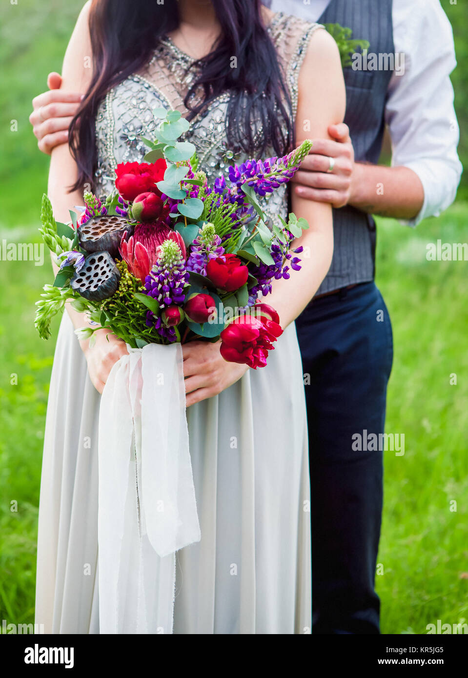 The crop image of romantic couple with flowers Stock Photo - Alamy