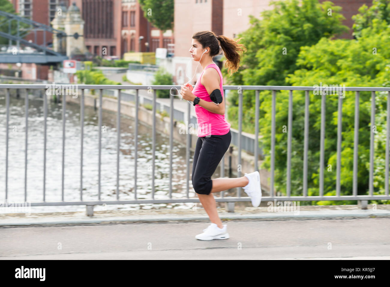 Athlete Woman Running On Sidewalk Stock Photo - Alamy