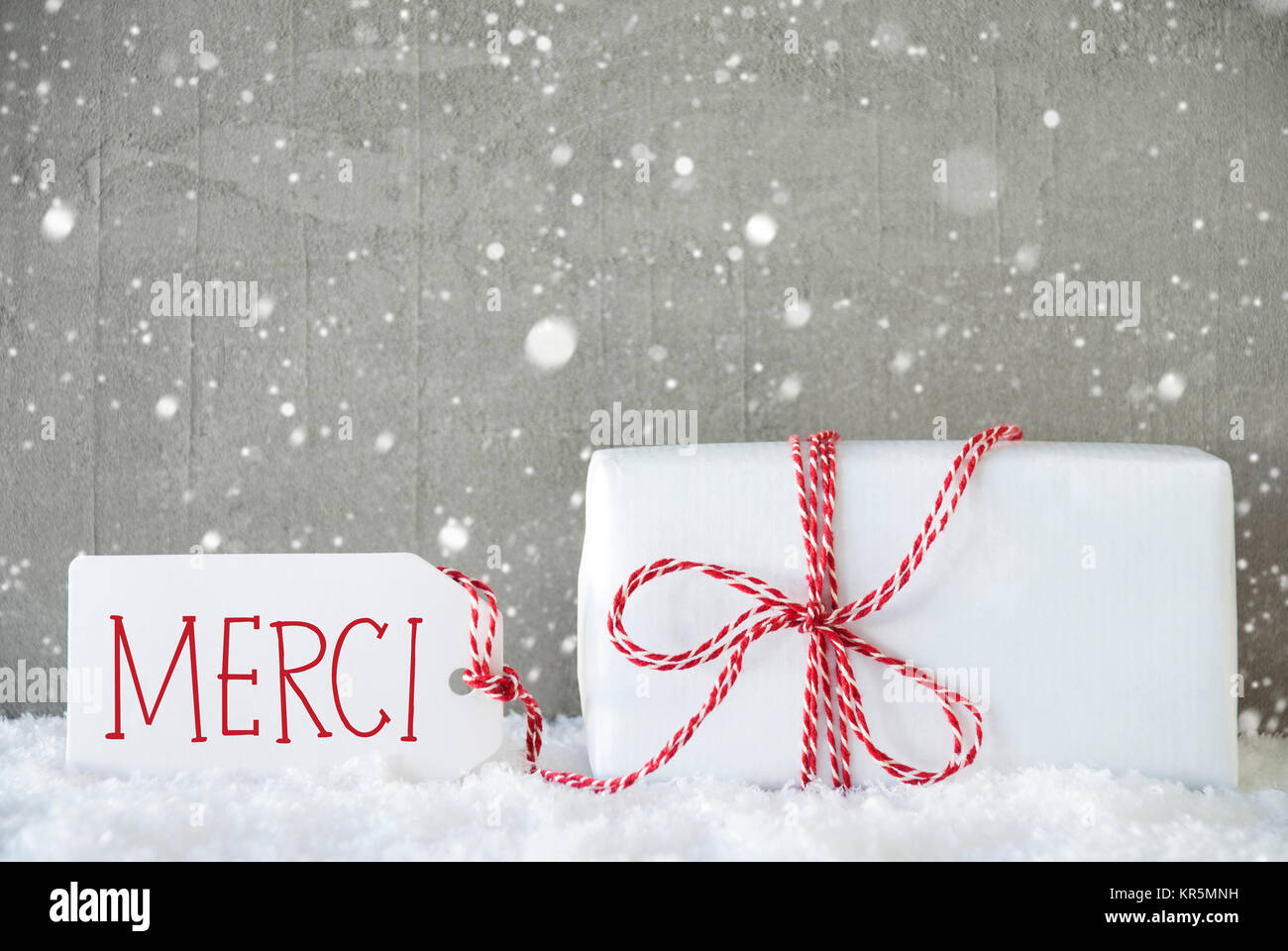 gift,cement background with snowflakes,merci means thank you Stock ...