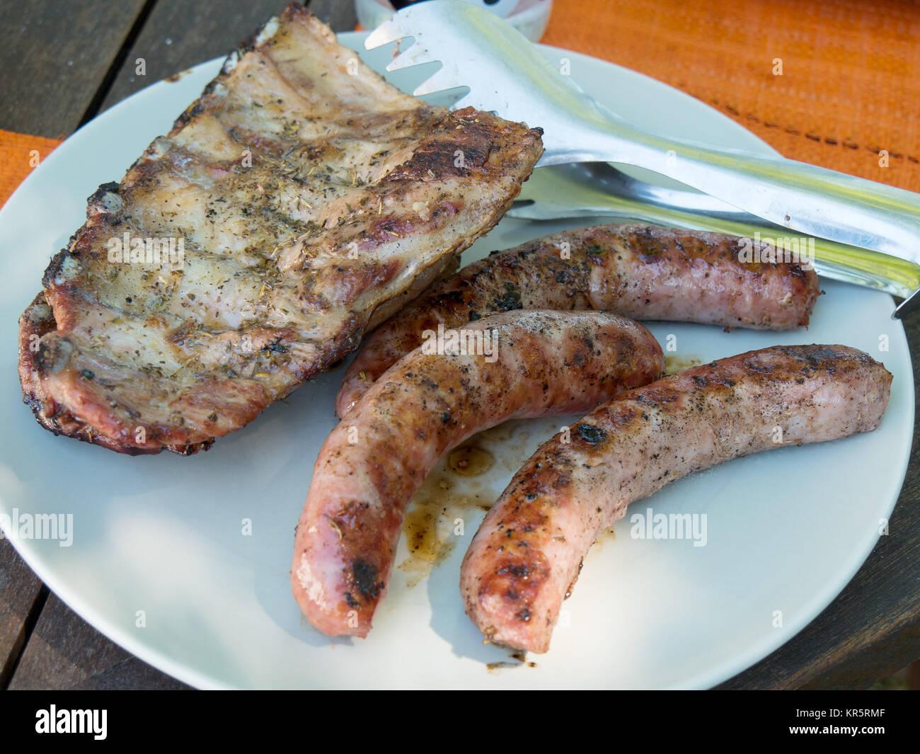 grilled and cooked sausage with barbecue Stock Photo - Alamy
