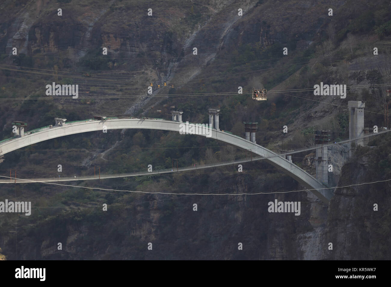 Chengdu, China's Sichuan Province. 13th Dec, 2017. Villagers cross the ...