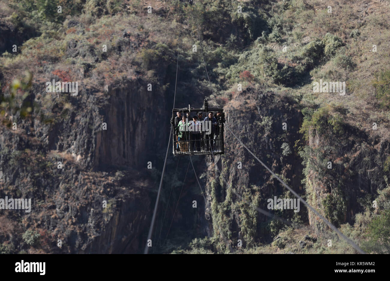 Chengdu, China's Sichuan Province. 13th Dec, 2017. Villagers cross the ...