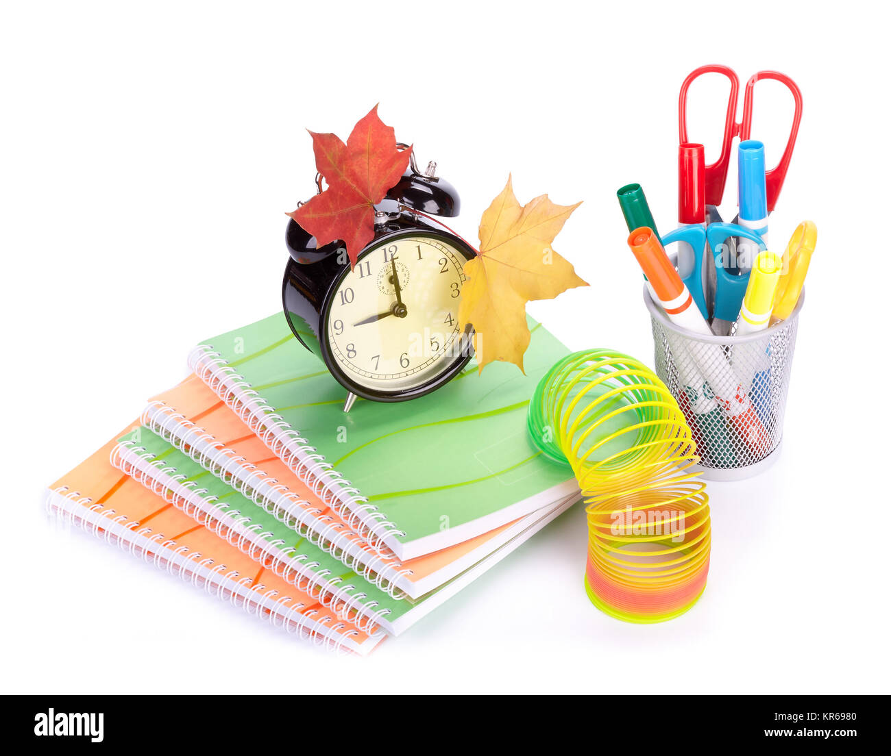 Pile of writing-book and alarm clock Stock Photo - Alamy