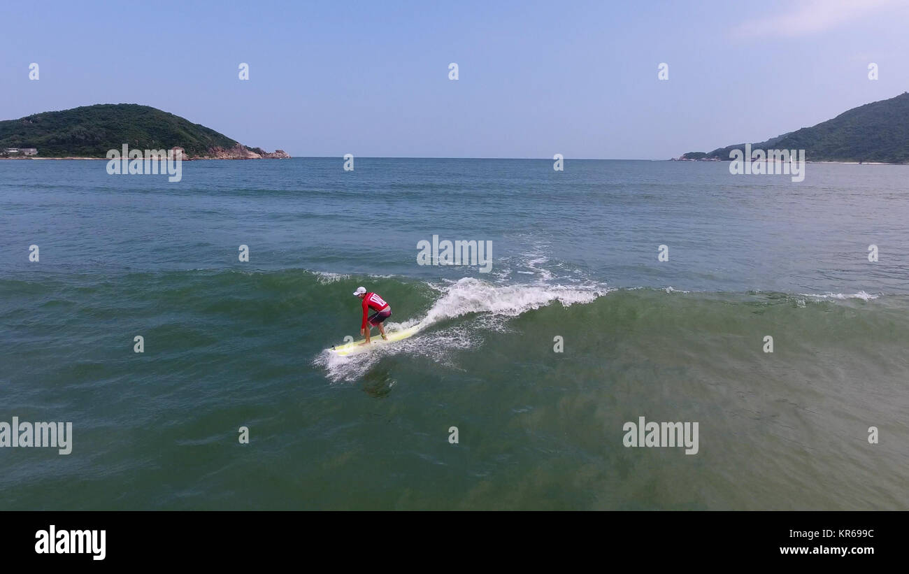 Aerial top view of surfing man in Hainan in China Stock Photo - Alamy