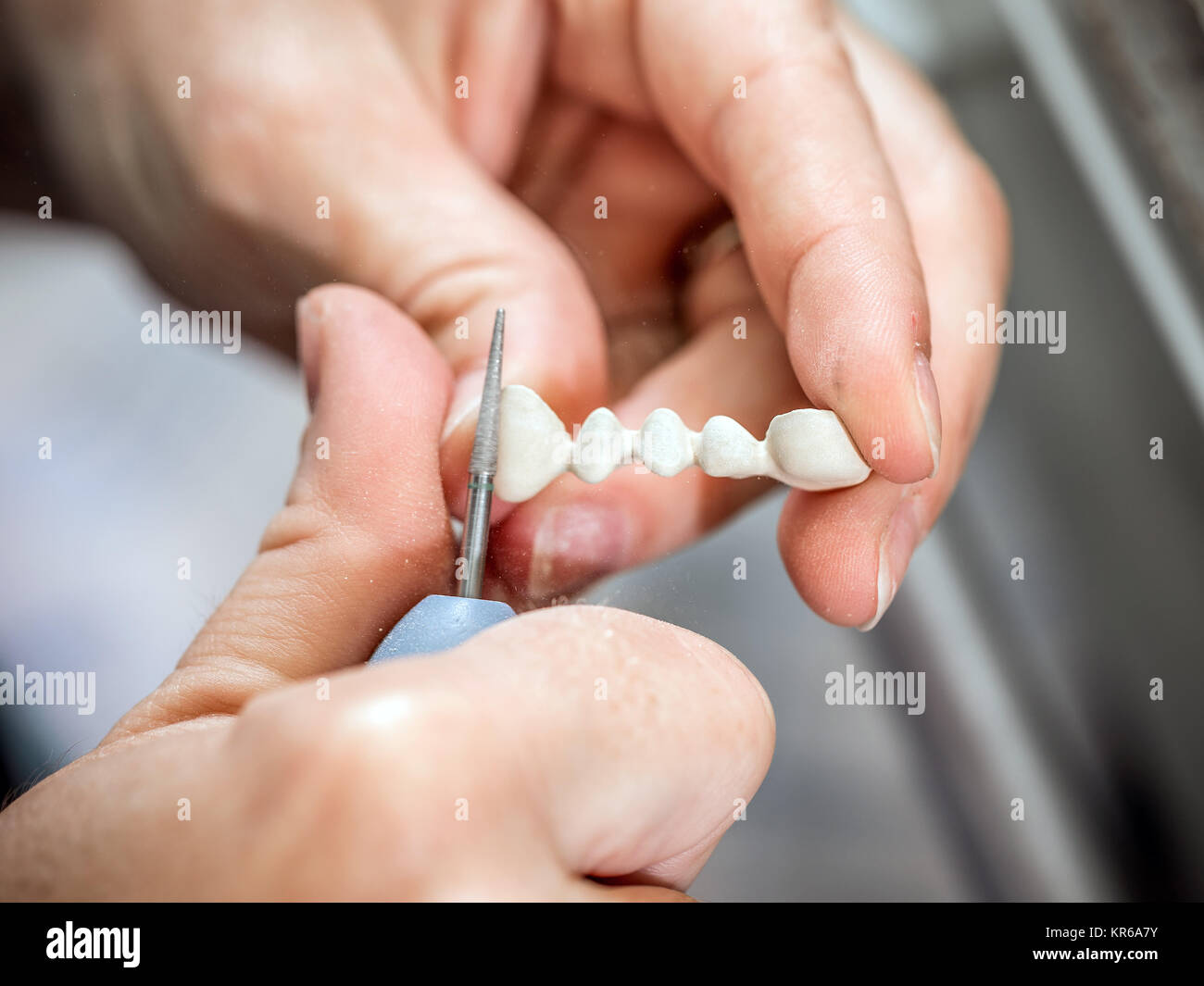 Dental technician molding teeth Stock Photo - Alamy