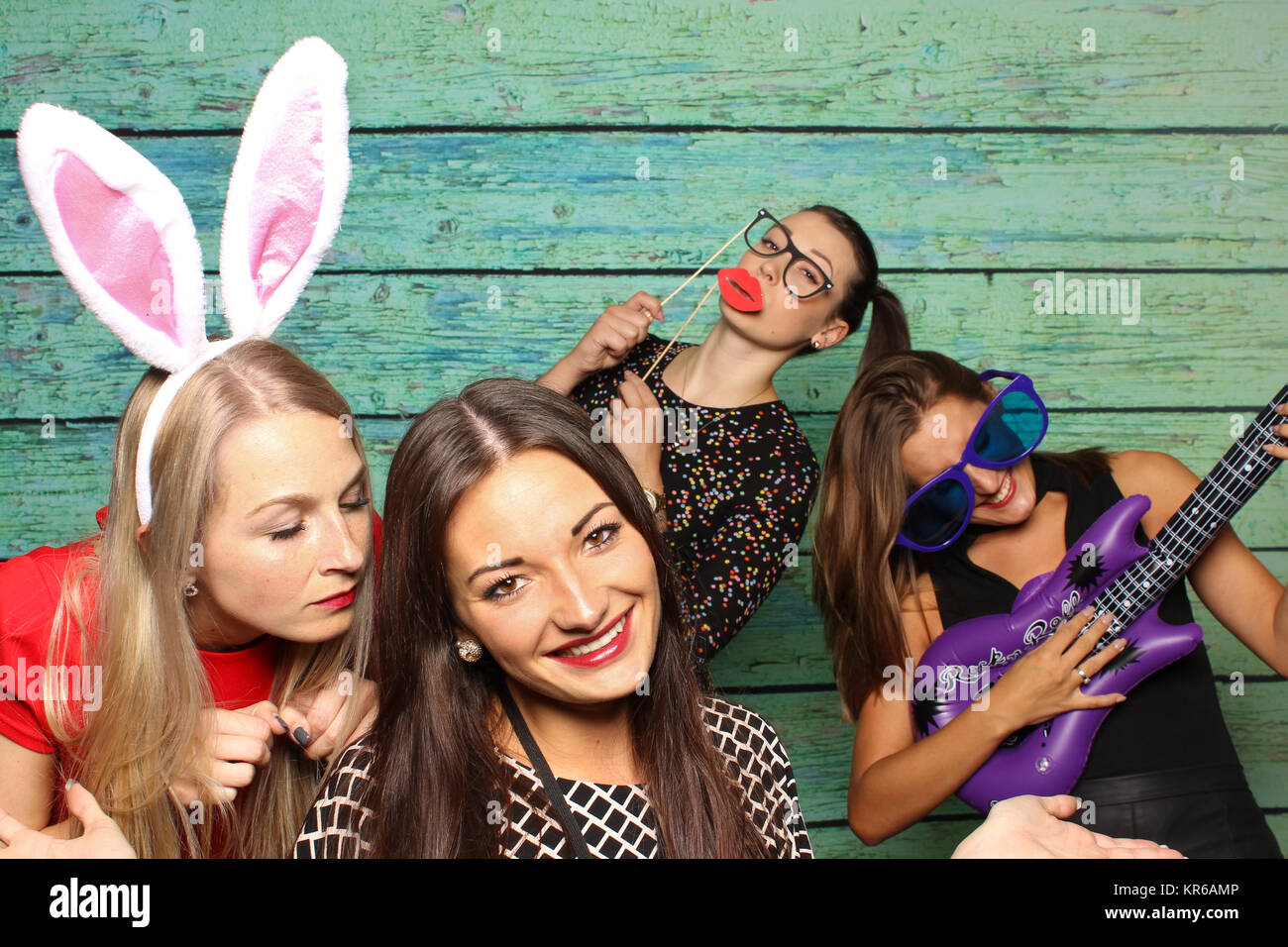 girls have fun with a photo box - photo booth party Stock Photo - Alamy