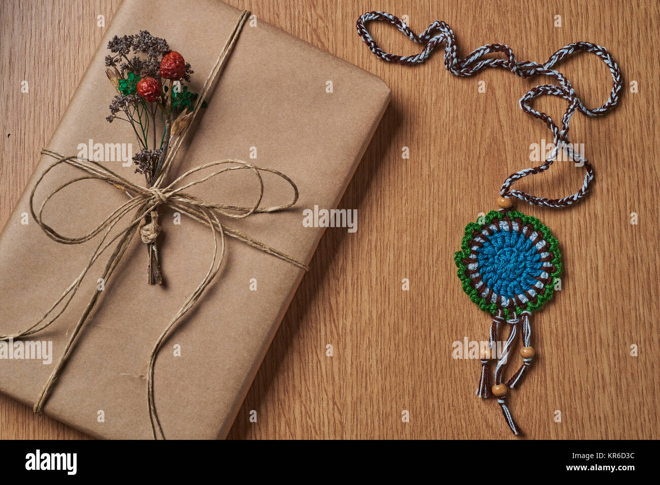 Book is wrapped in brown paper, tied with paper thread lying on the ...