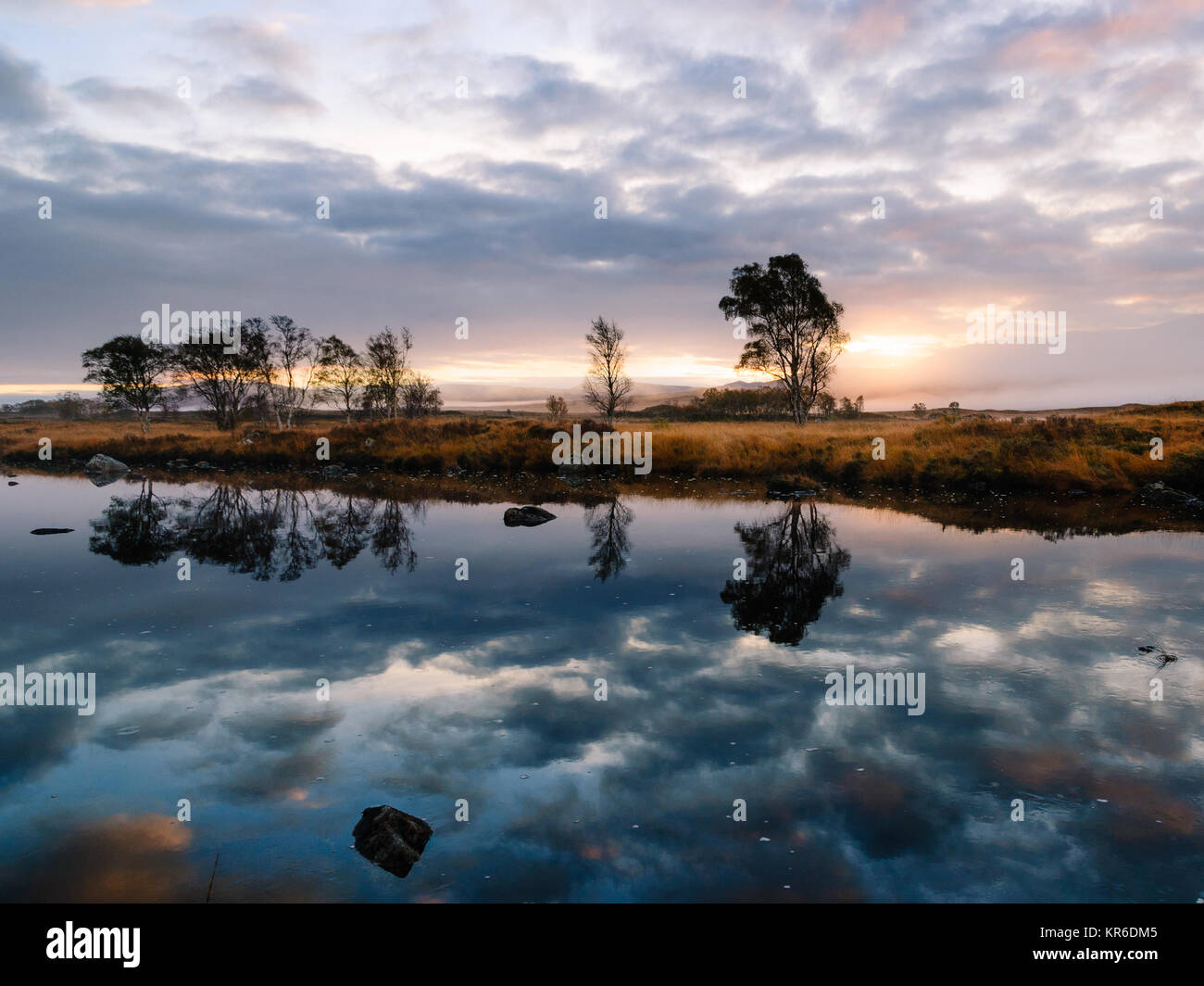 October sunrise at Loch Ba, Rannoch Moor, Scottish Highlands. As the ...