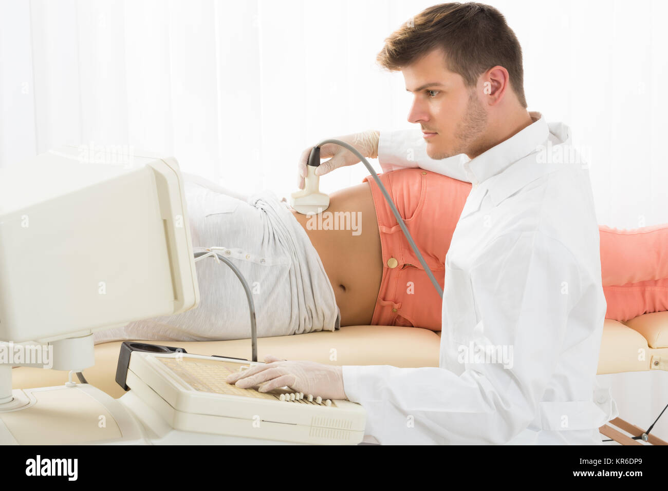 Woman Getting Ultrasound From Doctor Stock Photo - Alamy