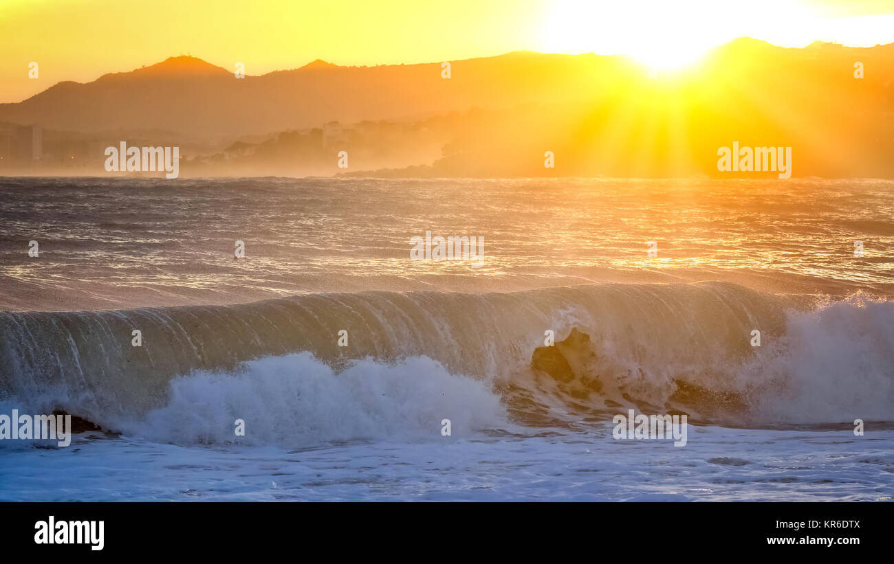Beautiful sunset in Spain with big waves, Costa Brava Stock Photo - Alamy