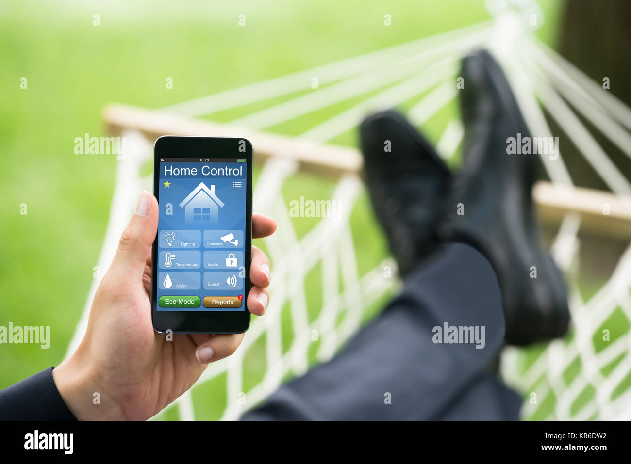 Man With Mobile Phone Showing Home Control System Stock Photo - Alamy