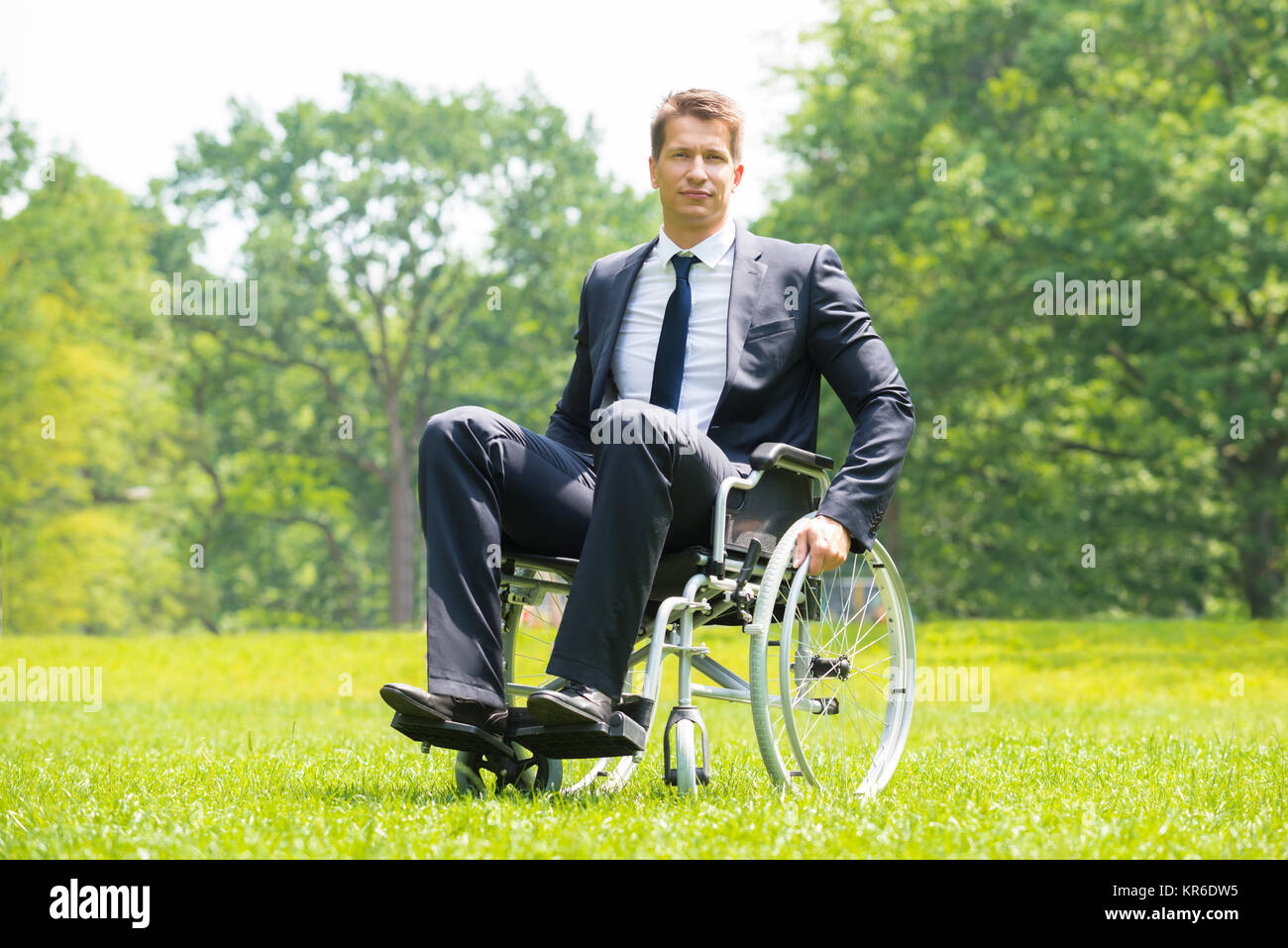 Disabled Man On Wheelchair Stock Photo - Alamy