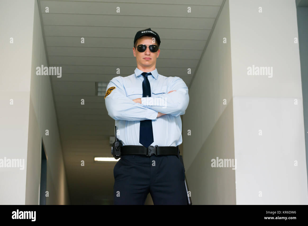 Security Guard Standing At The Entrance Stock Photo - Alamy