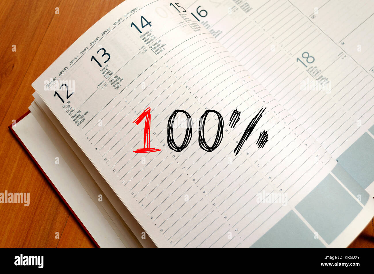 One hundred percent symbol on notebook Stock Photo - Alamy