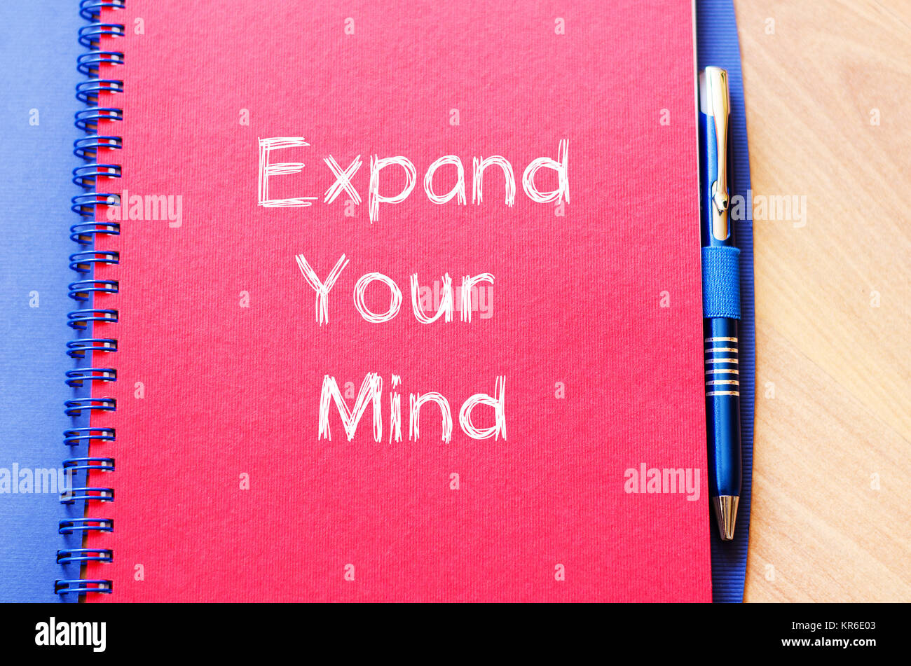 Expand your mind on notebook Stock Photo - Alamy