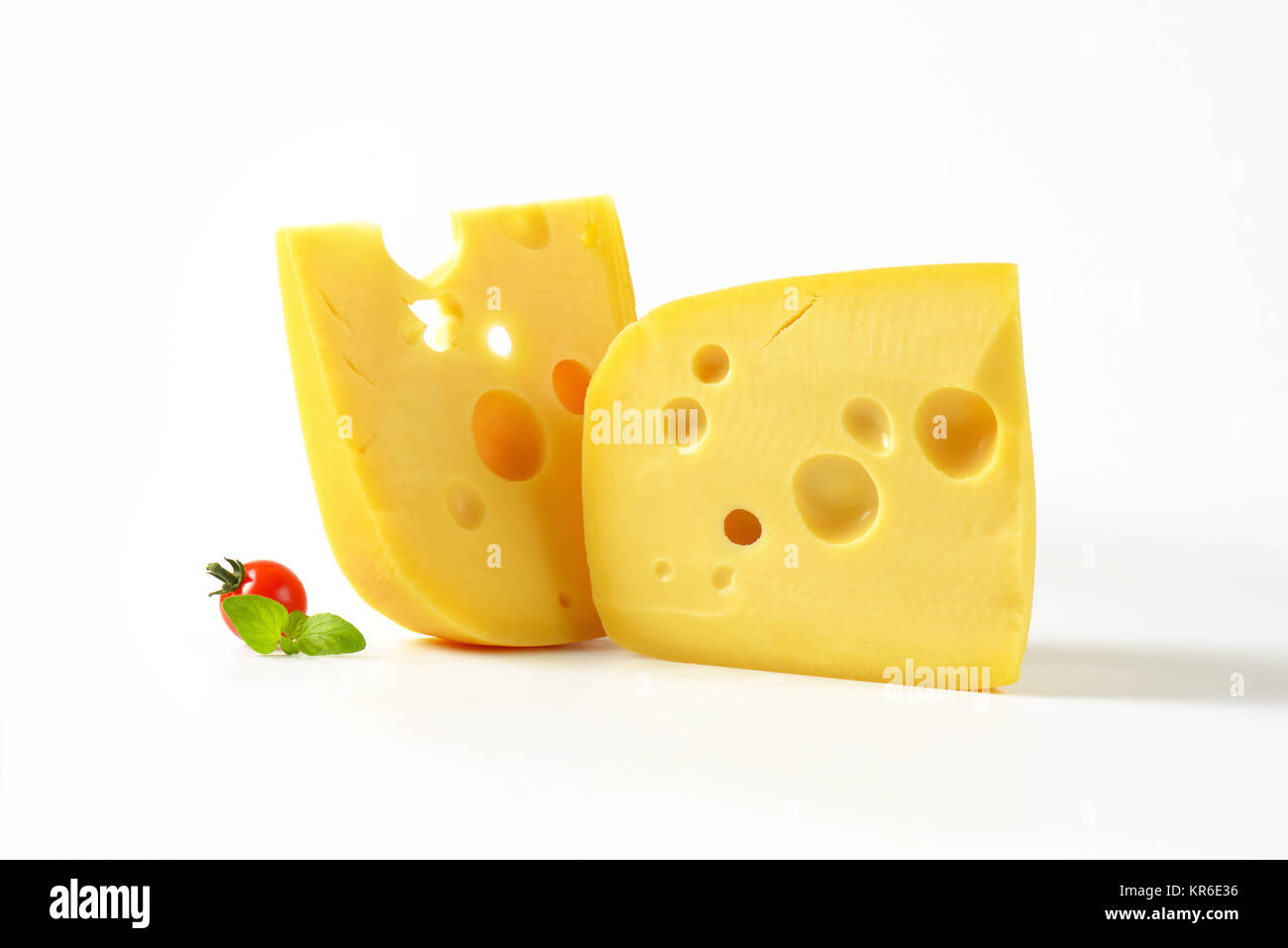 wedges of yellow cheese with eyes Stock Photo - Alamy