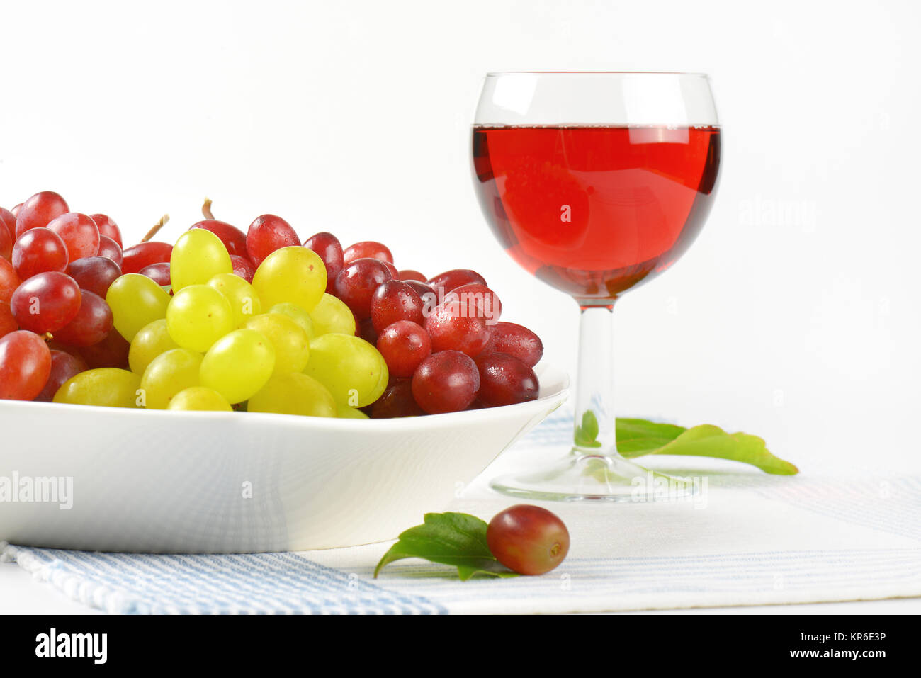 fresh grapes and glass of wine or juice Stock Photo - Alamy
