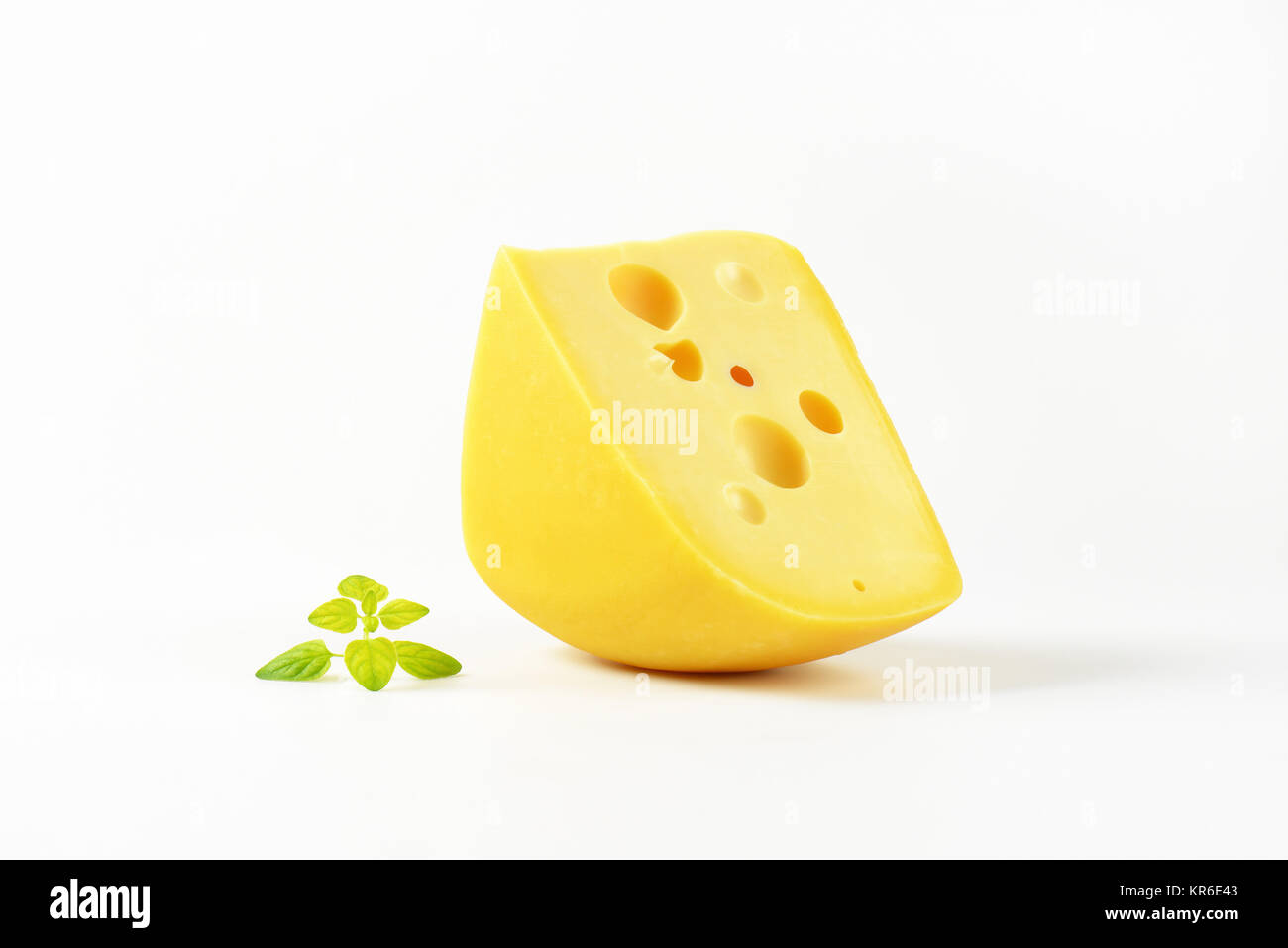 wedge of Swiss cheese Stock Photo - Alamy