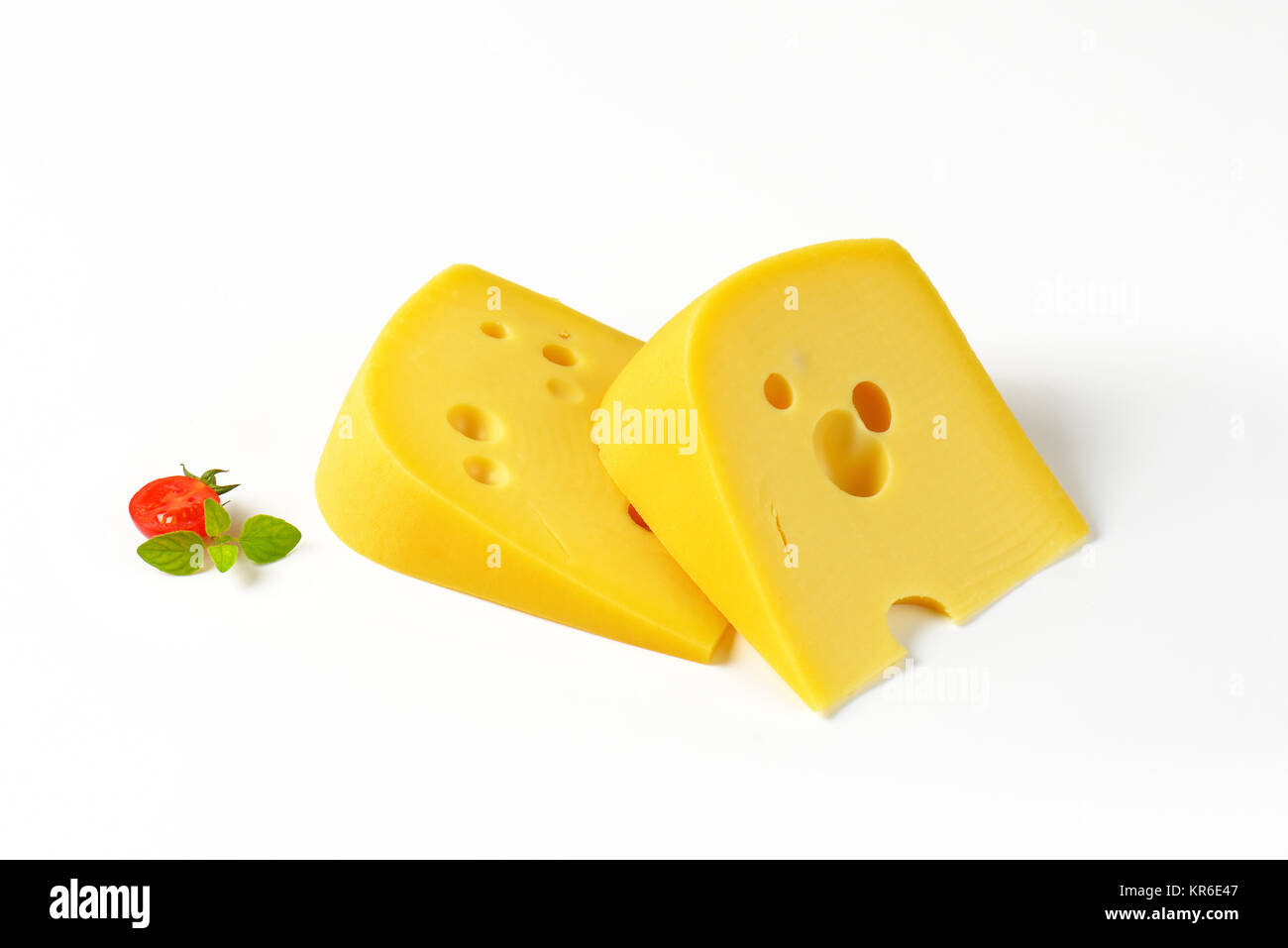wedges of yellow cheese with eyes Stock Photo - Alamy