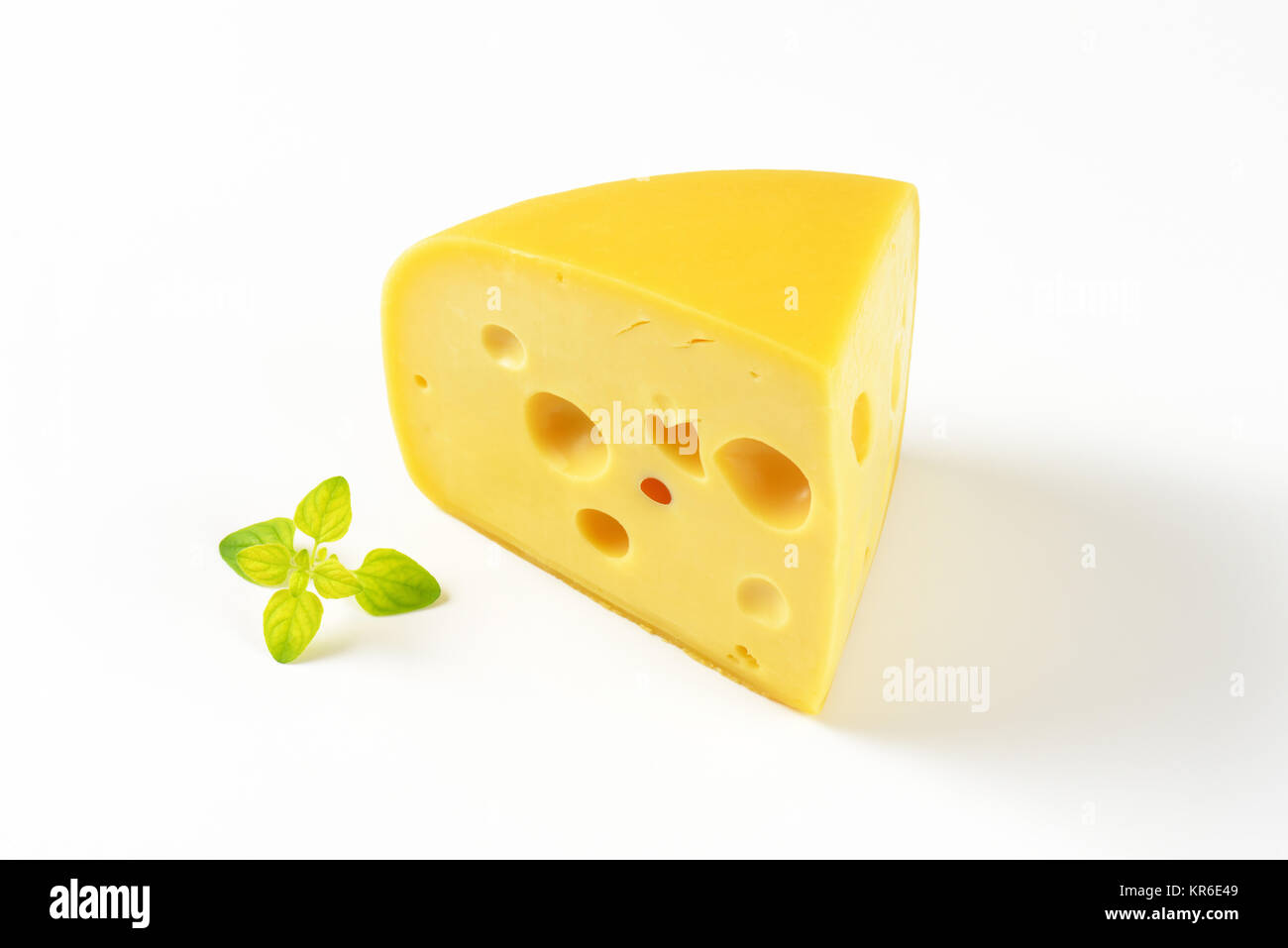 wedge of Swiss cheese Stock Photo - Alamy