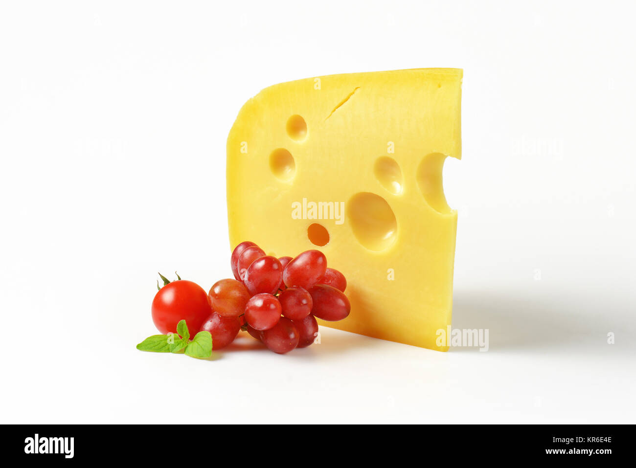 Wedge fresh swiss cheese Cut Out Stock Images & Pictures - Alamy