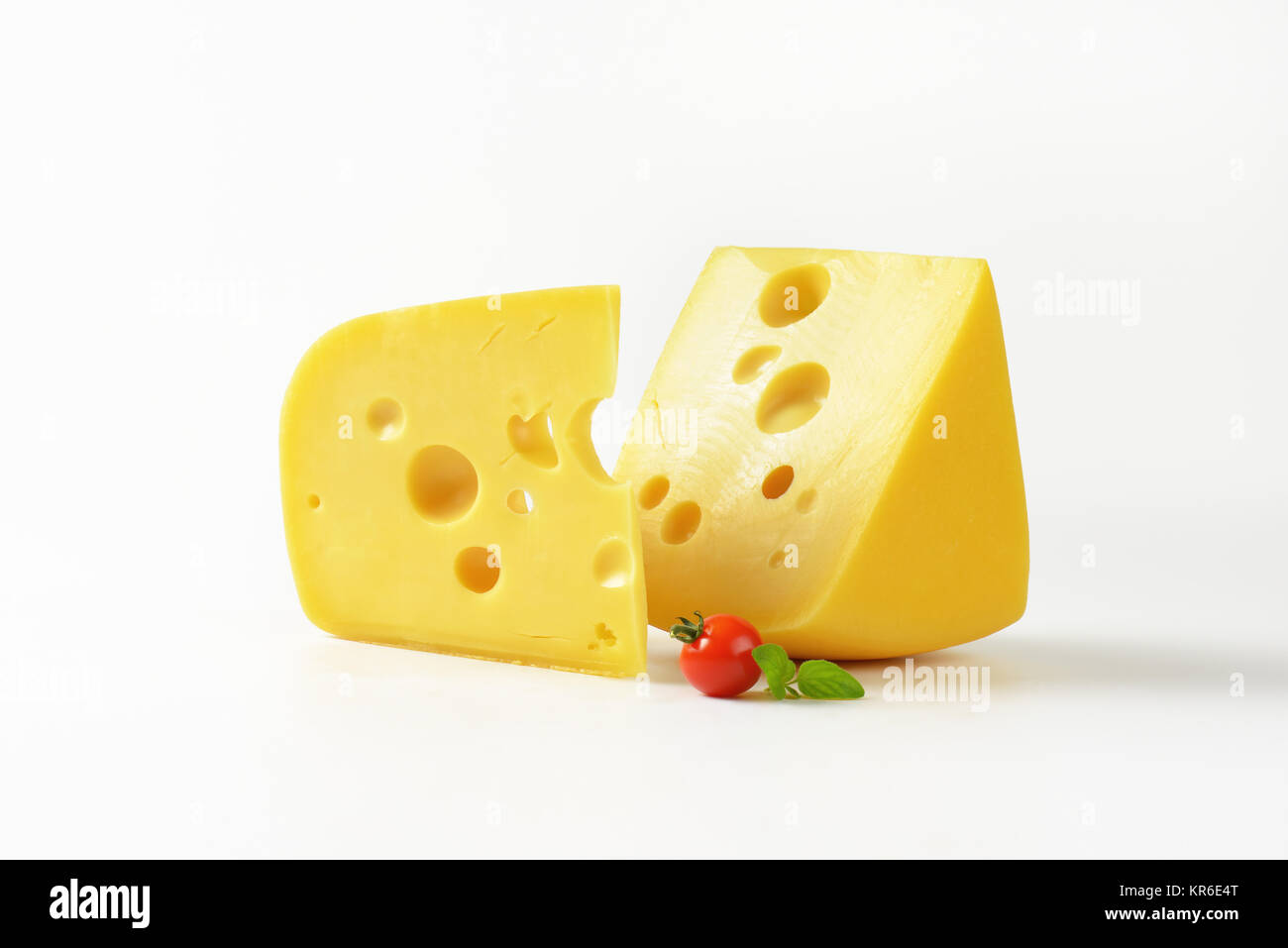 wedges of yellow cheese with eyes Stock Photo - Alamy