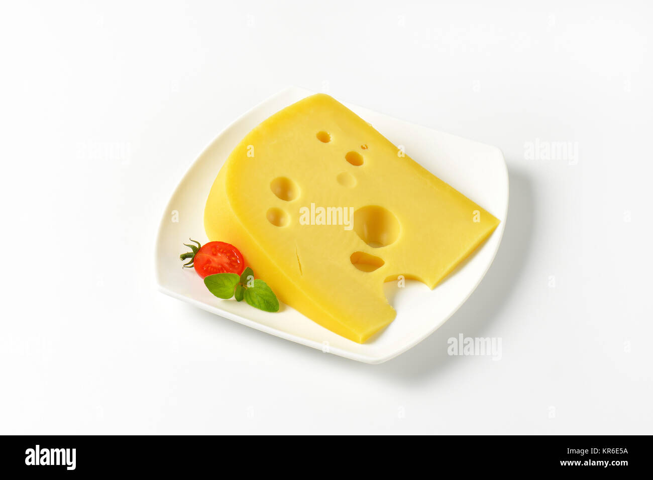 wedge of yellow cheese with eyes Stock Photo - Alamy