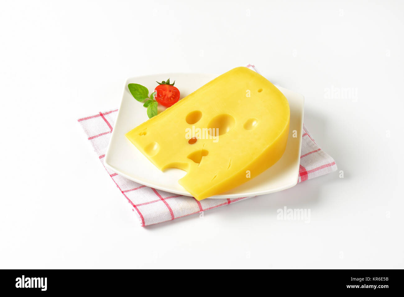 wedge of yellow cheese with eyes Stock Photo - Alamy