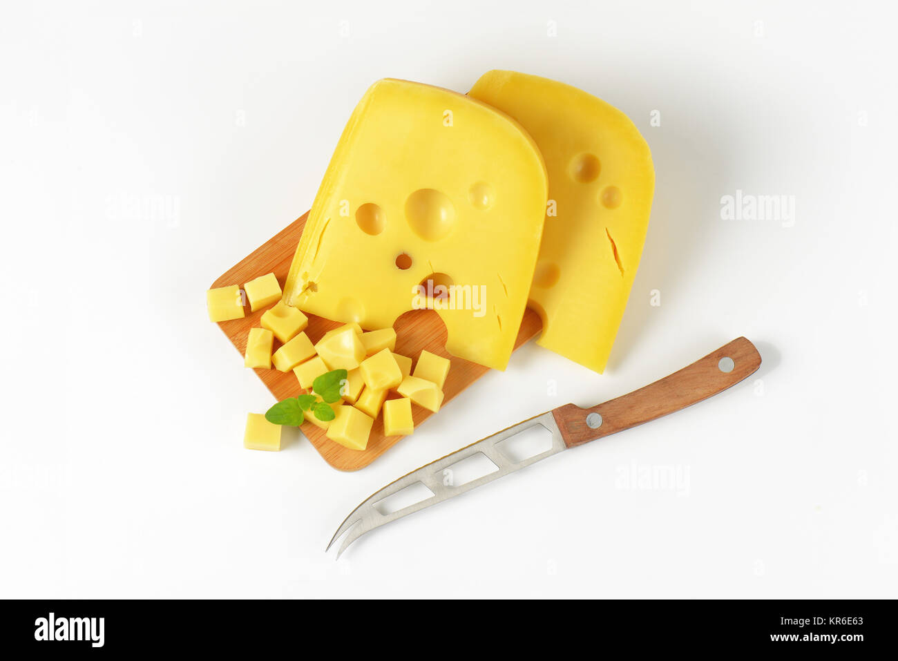 Wedges and cubes of Swiss cheese Stock Photo - Alamy