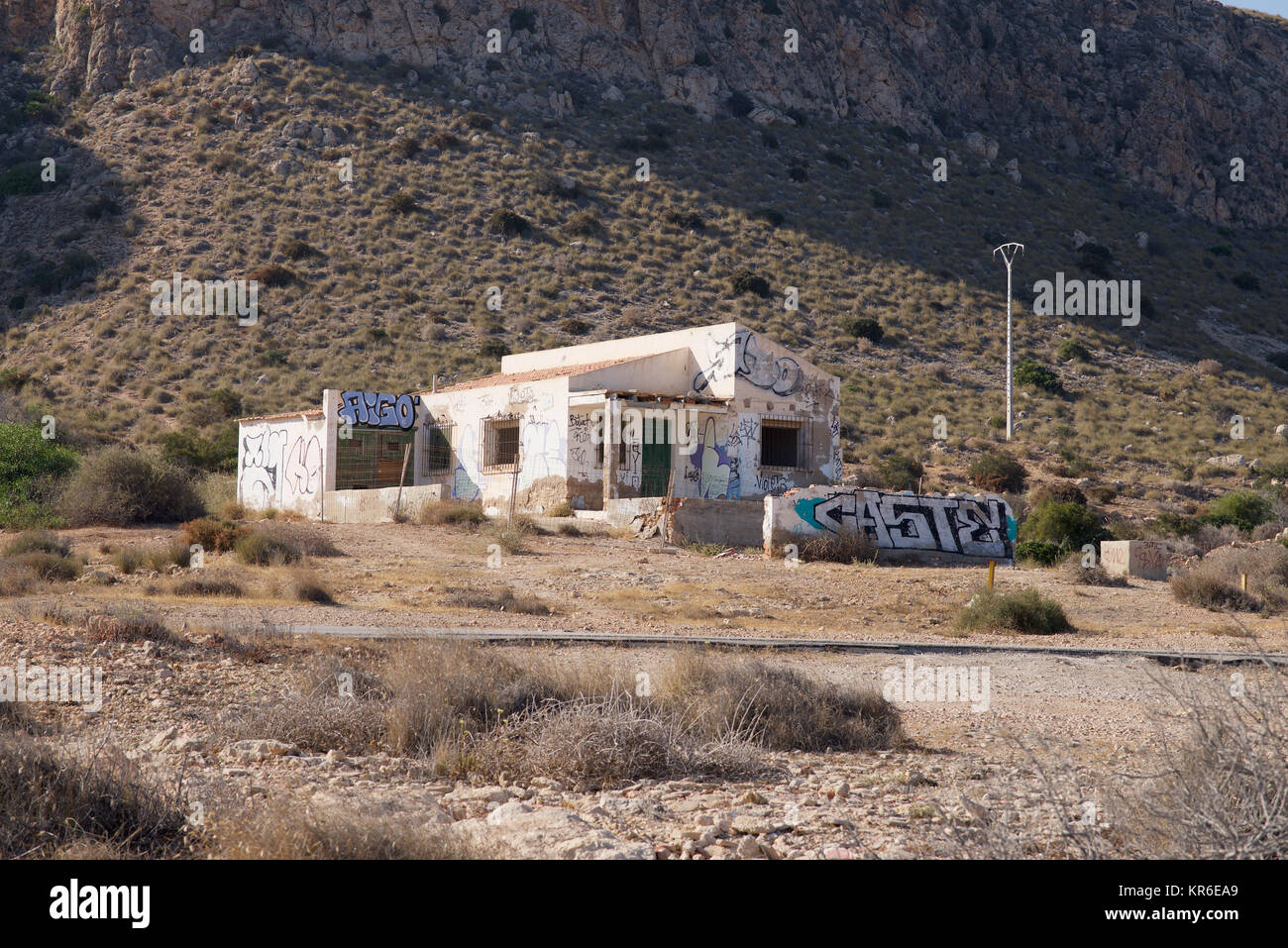 Run-down abandoned villa by the side of a road Stock Photo - Alamy