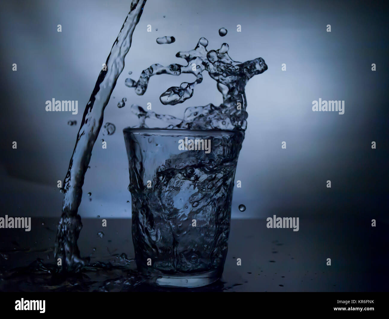 glass of water spilling Stock Photo - Alamy