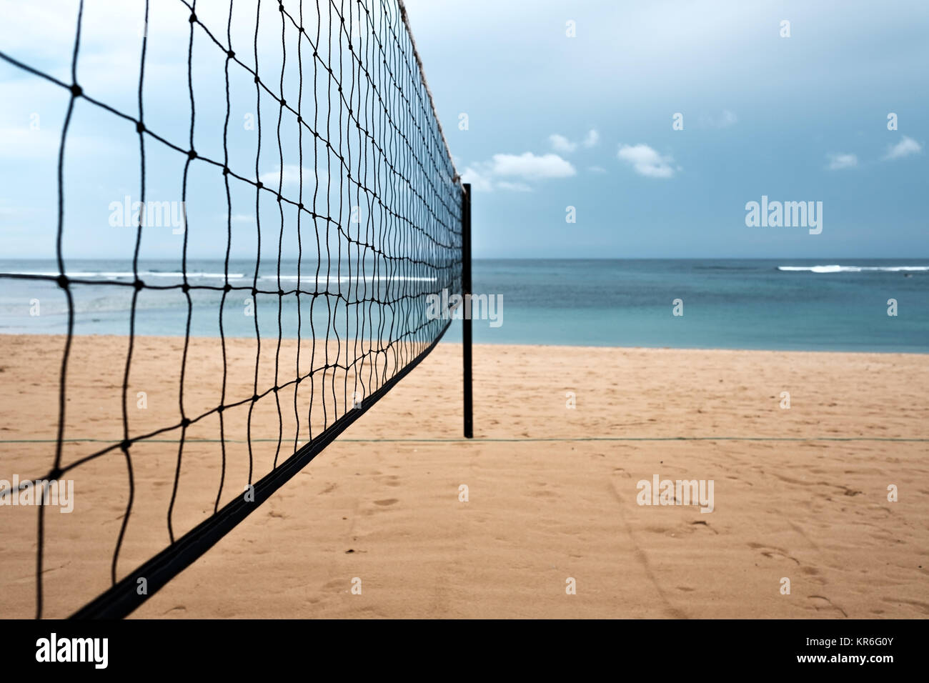 Volleyball net on the sand beach on tropical island. Sport during ...