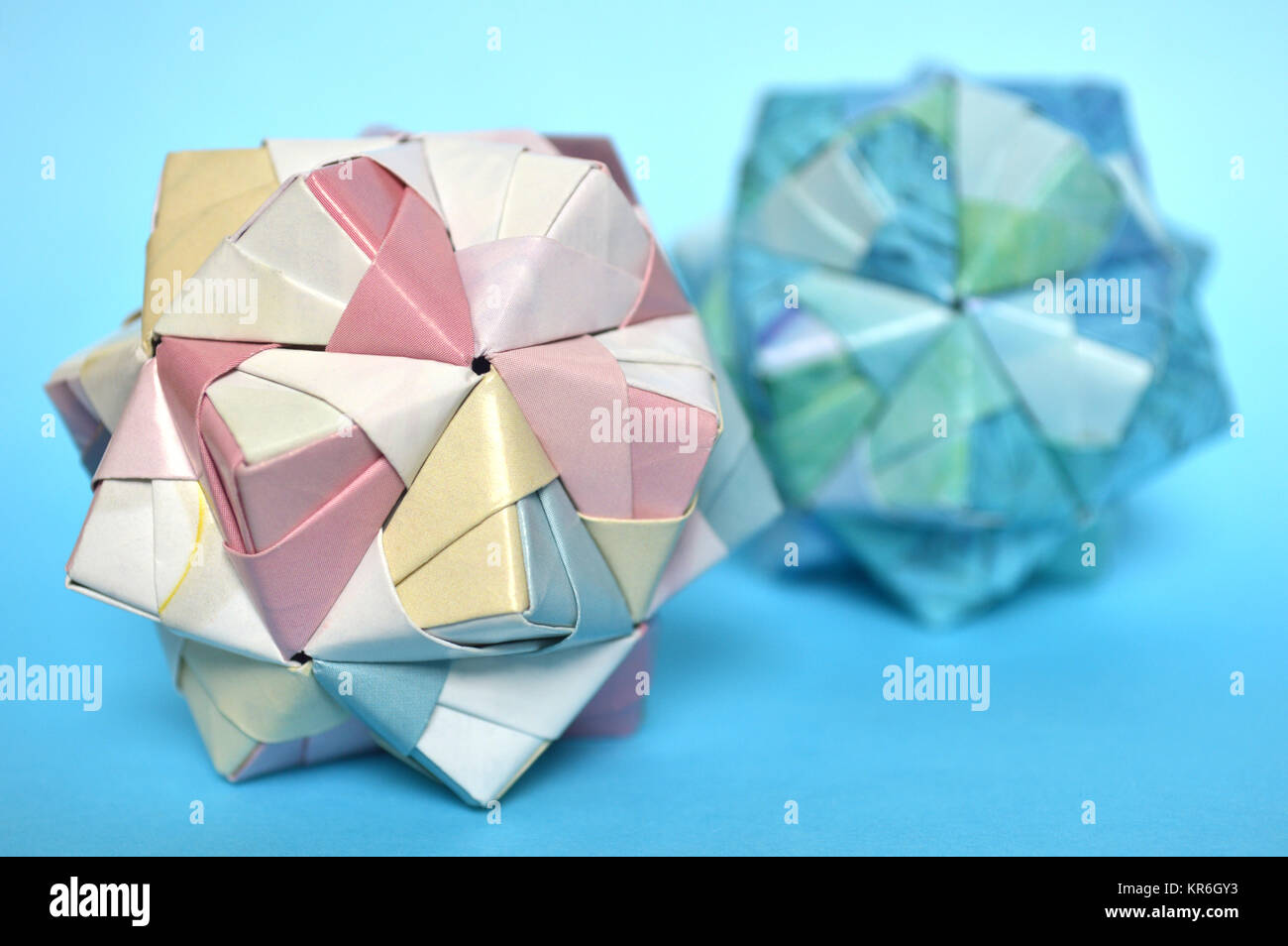 Modular origami, sonobe ball, on blue background Stock Photo - Alamy