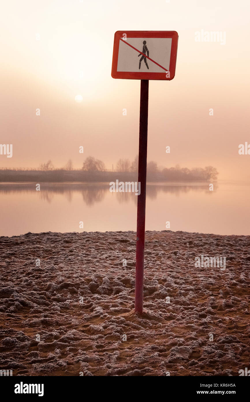 Restricted area sign in a gloomy landscape in the foggy background ...