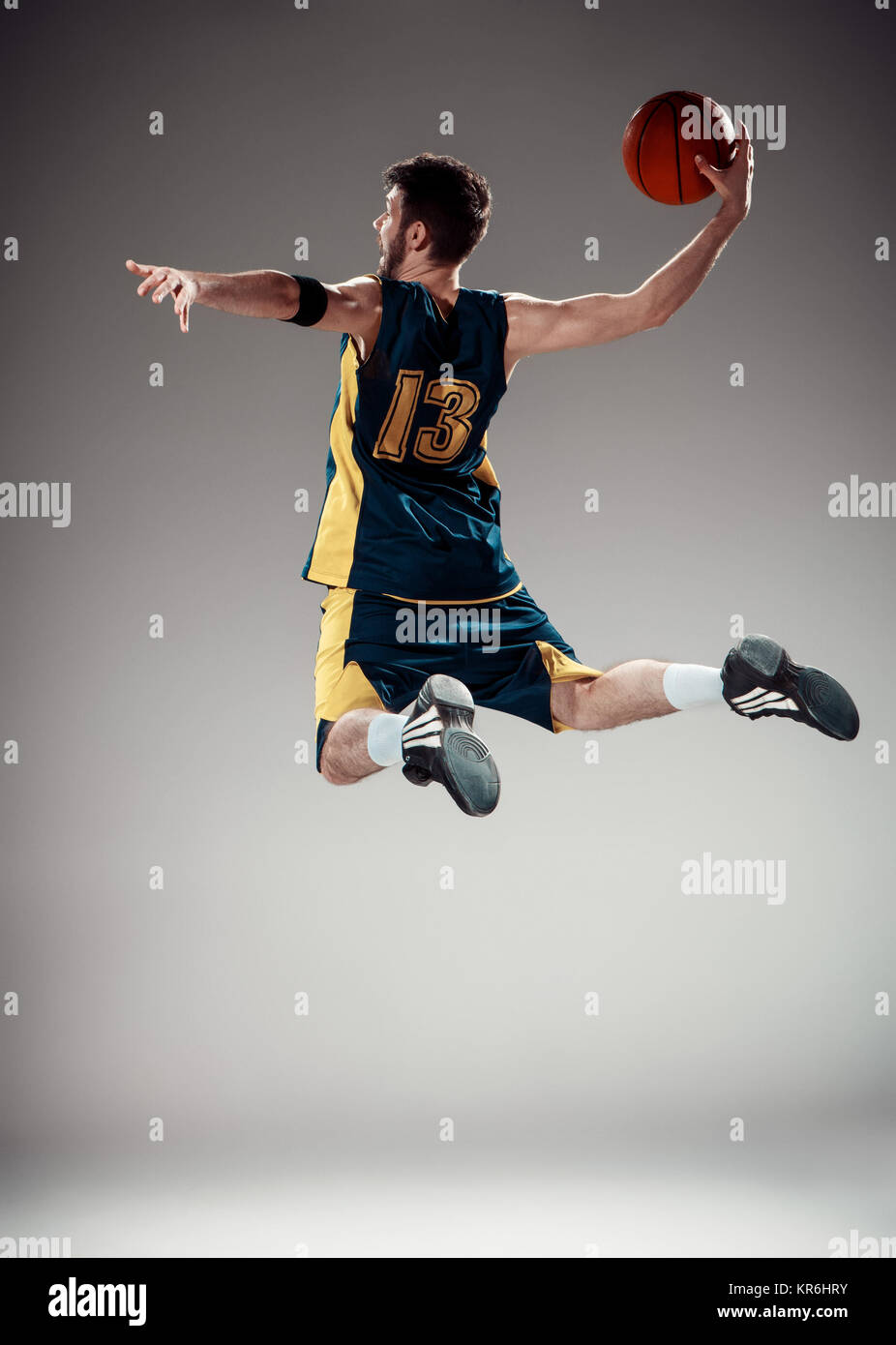 Full length portrait of a basketball player with ball Stock Photo - Alamy