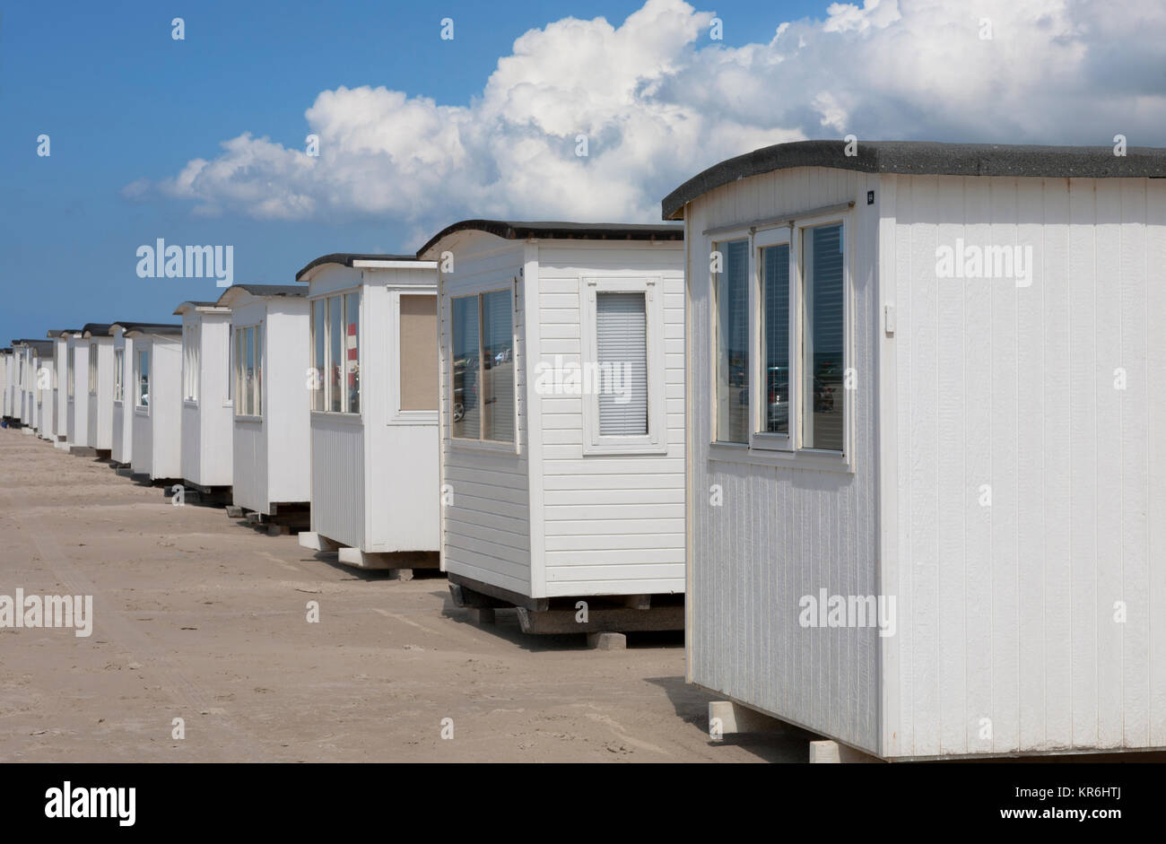 White beach cabins on the beach at Blokhus, a popular tourist resort at ...