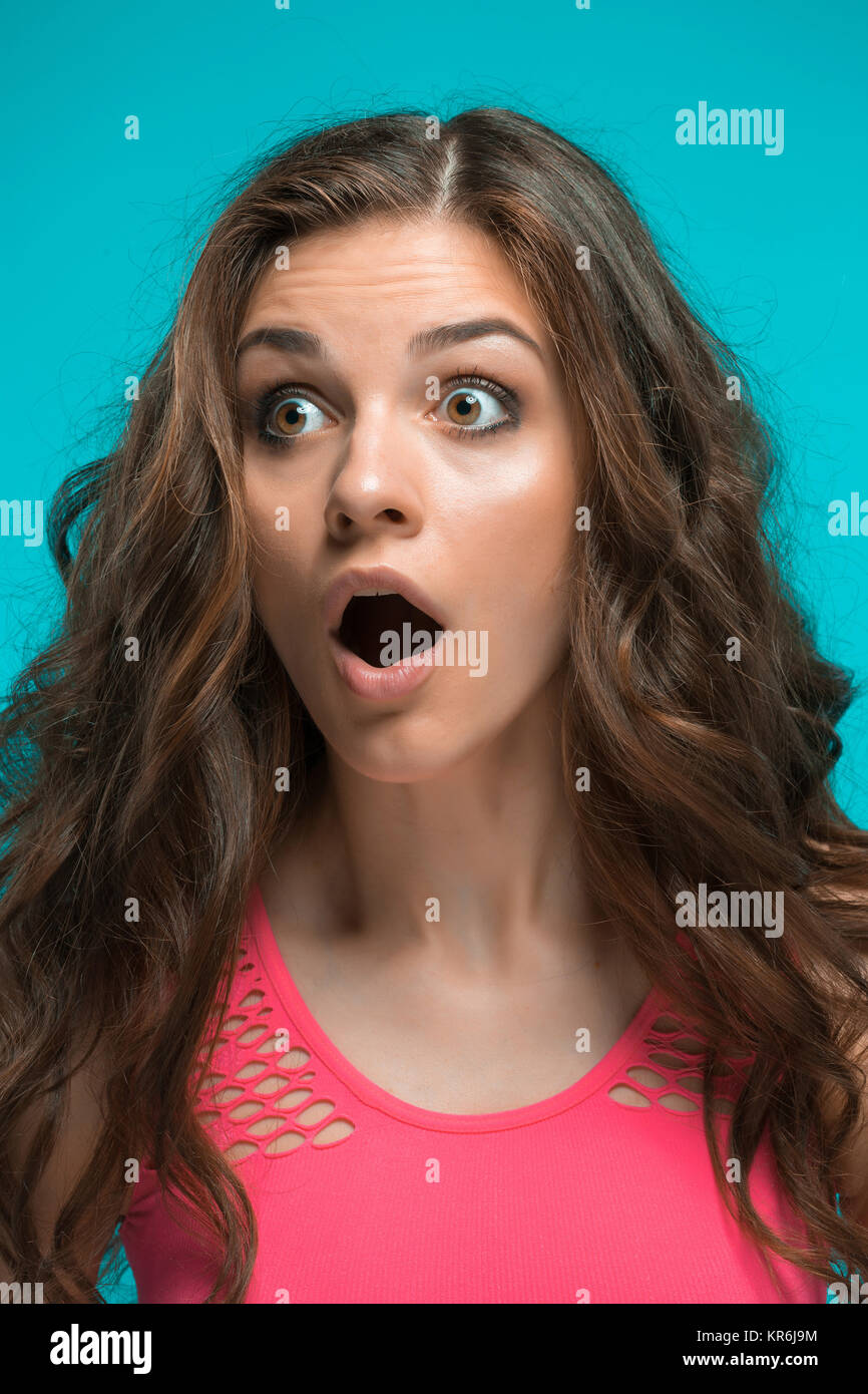 Portrait of young woman with shocked facial expression Stock Photo - Alamy