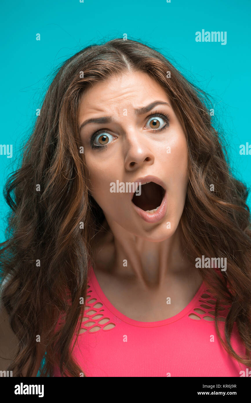 Portrait of young woman with shocked facial expression Stock Photo - Alamy