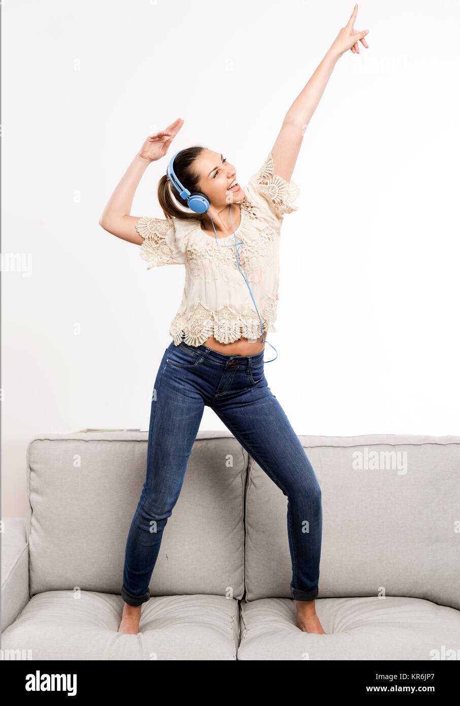Happy woman dancing Stock Photo - Alamy