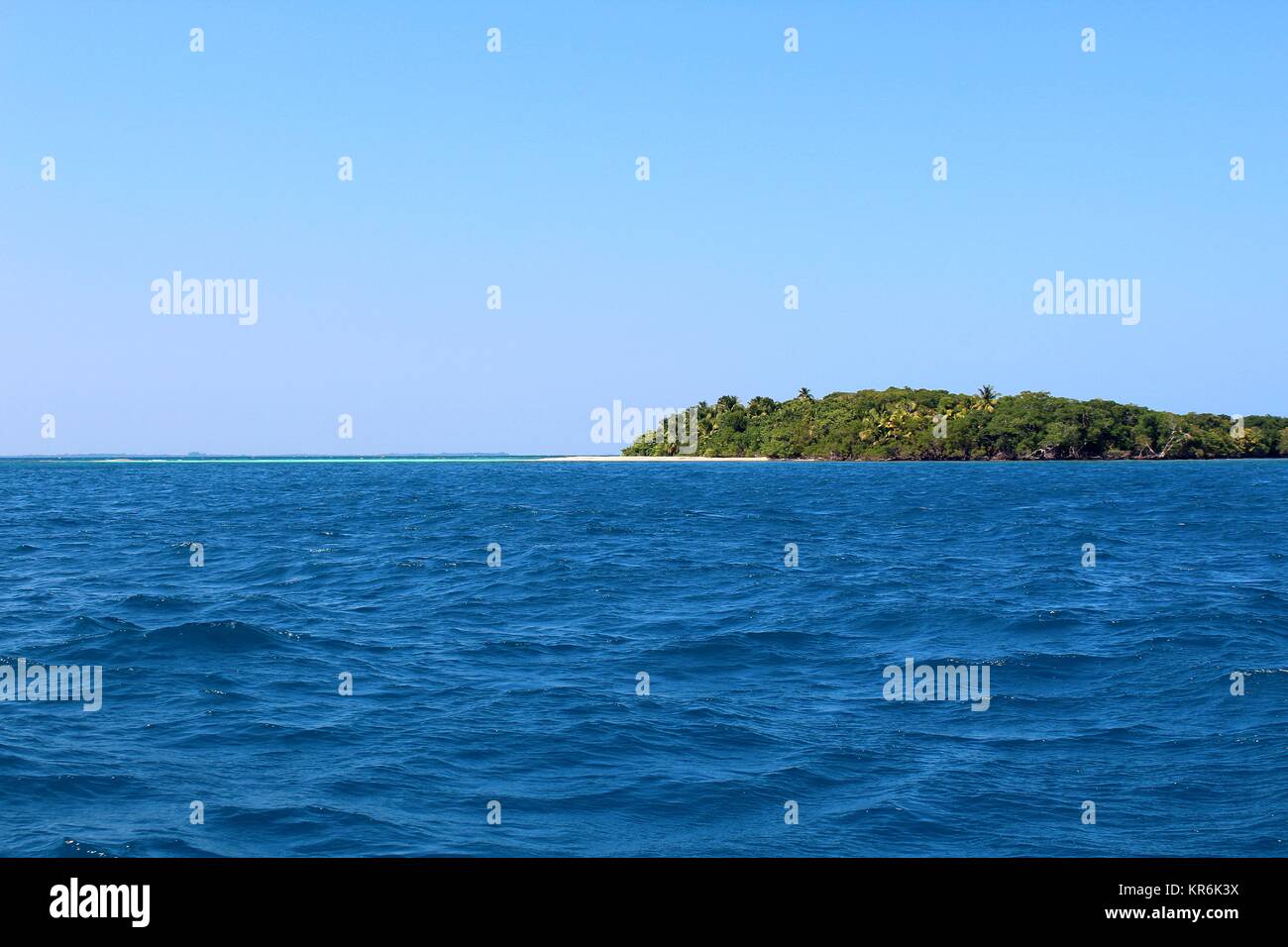 A Belize Key with a beautiful blue sky and ocean Stock Photo - Alamy