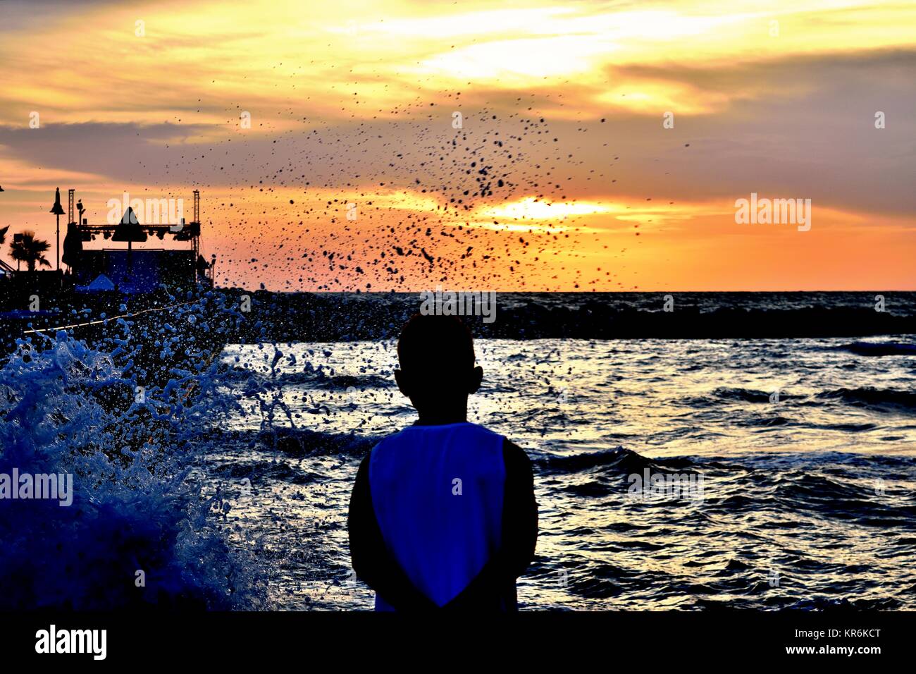 Child wave shore sunset hi-res stock photography and images - Alamy