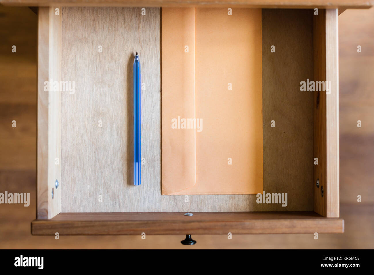 plastic pen and envelope in open drawer Stock Photo - Alamy